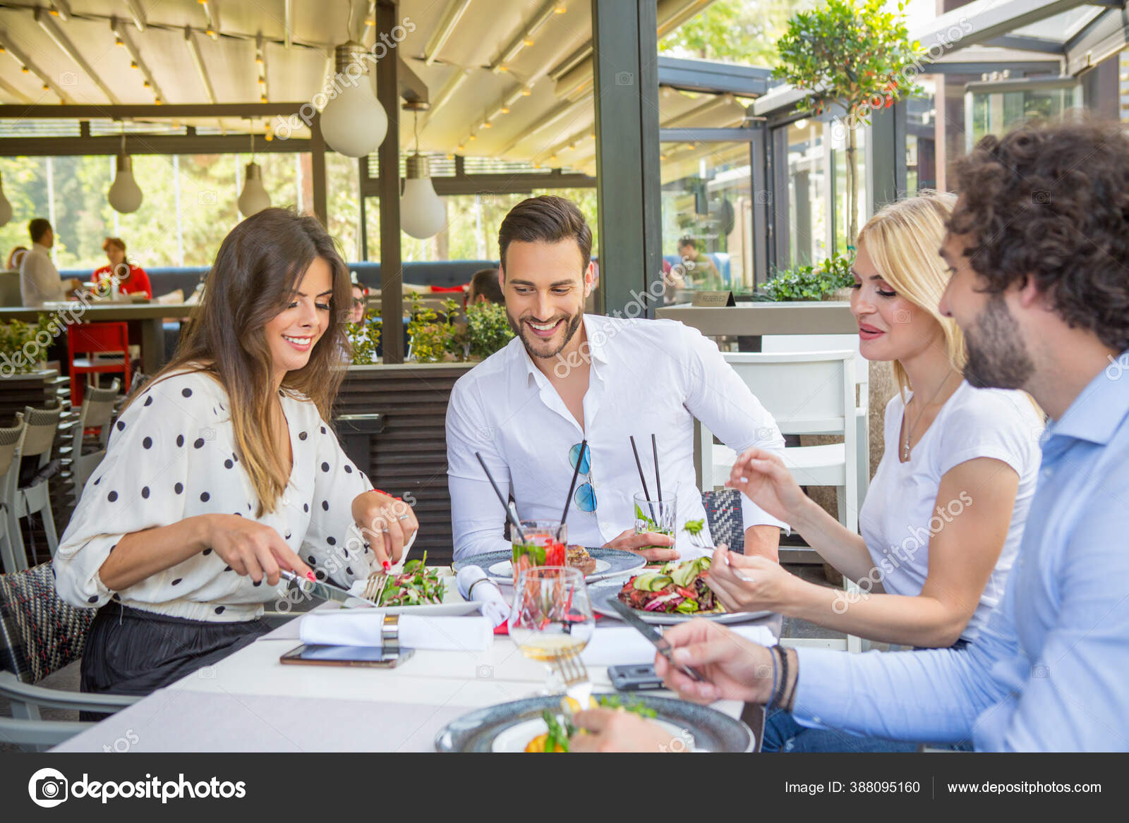 Group Friends Having Lunch Restaurant — Stock Photo © rilueda #388095160