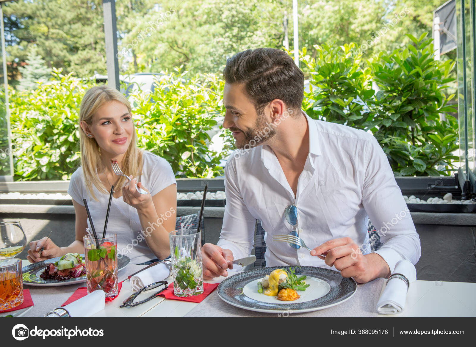 Beautiful Couple Having Lunch Restaurant Stock Photo by ©rilueda 388095178