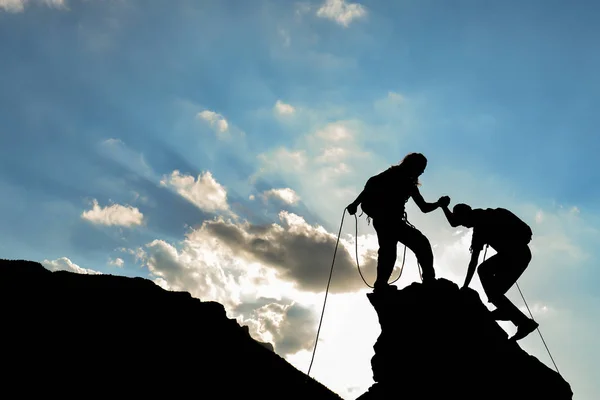rock climbing and the team focused on the target - Stock Image - Everypixel