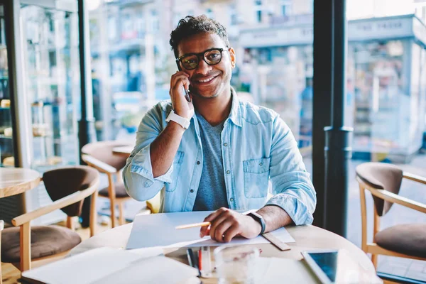 Portrait of successful creative male designer smiling at camera while ...