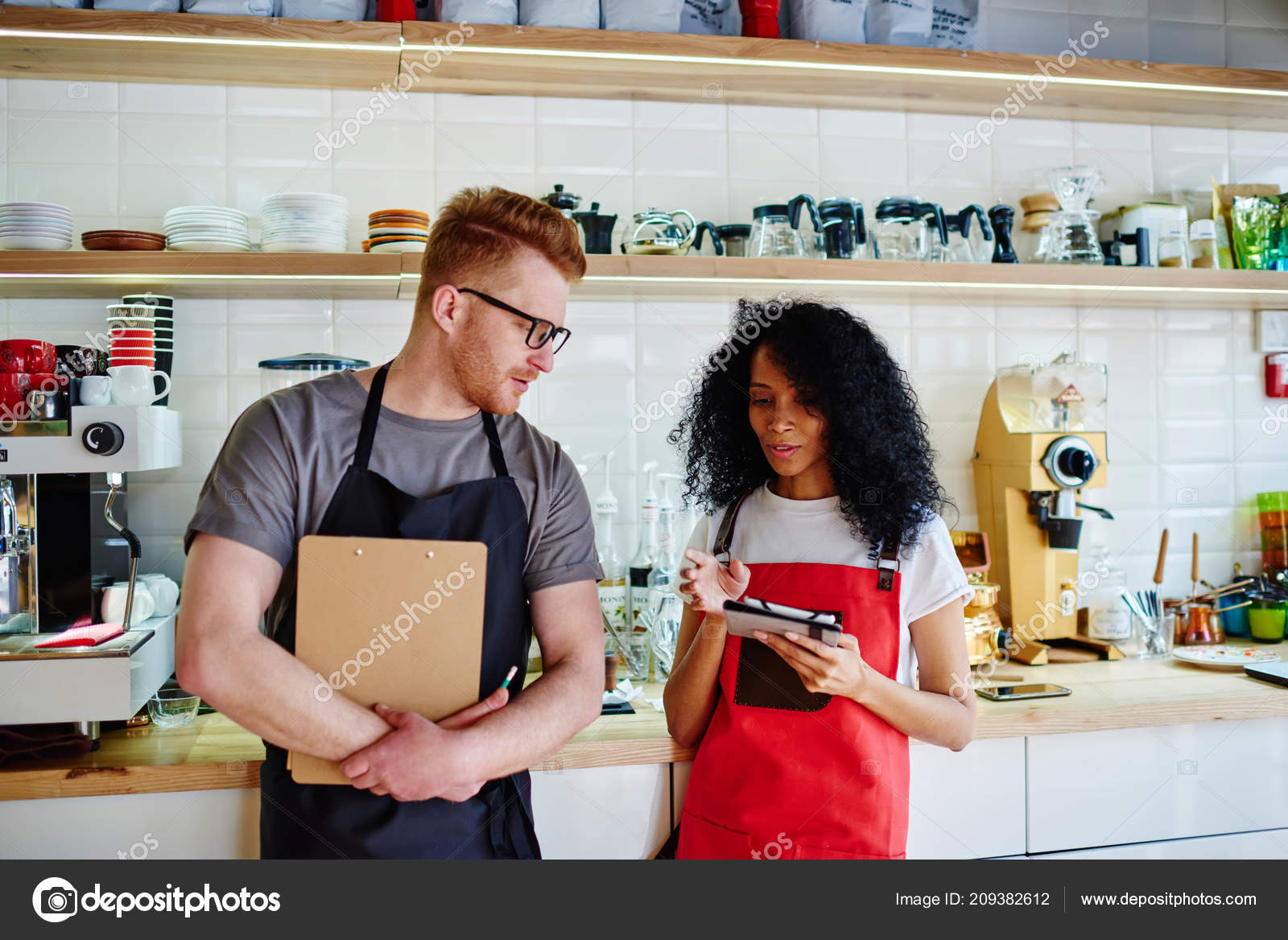 Two Diverse Colleagues Baristas Dressed Aprons Discussing Order Own ...