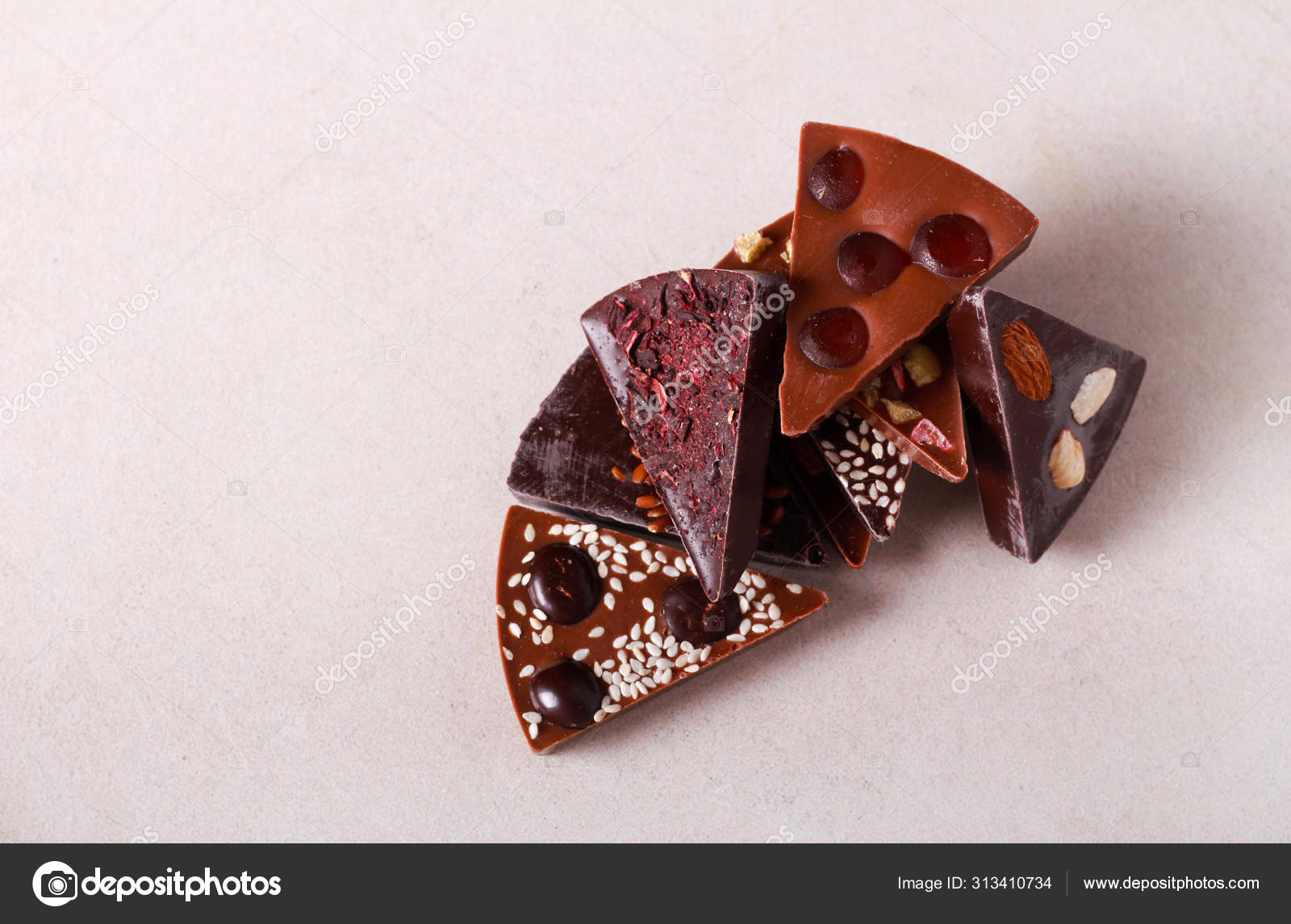 Assorted chocolate triangles Stock Photo by ©manyakotic 313410734
