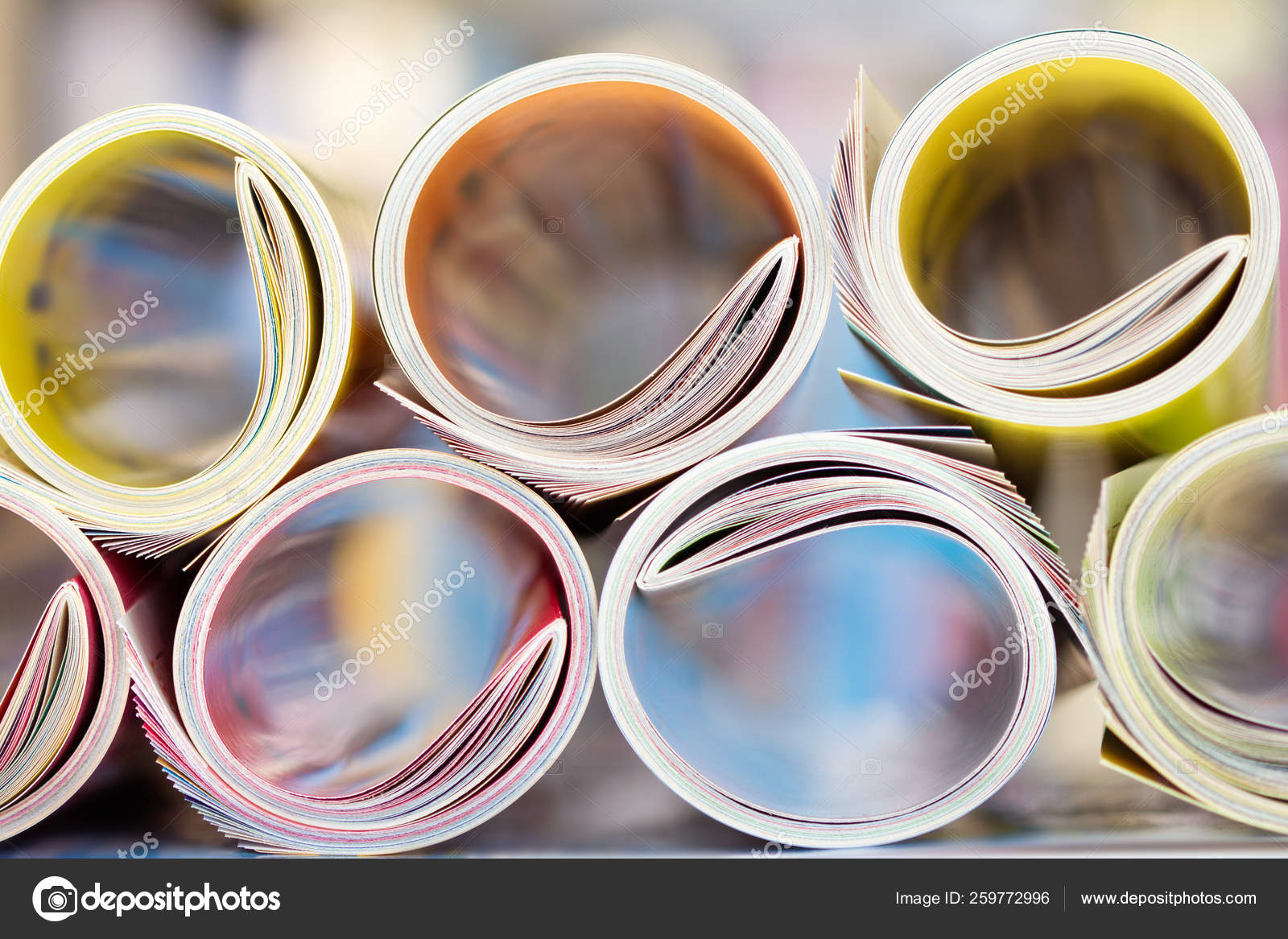 Close up edge of colorful magazine stacking roll with blurry bo — Stock ...