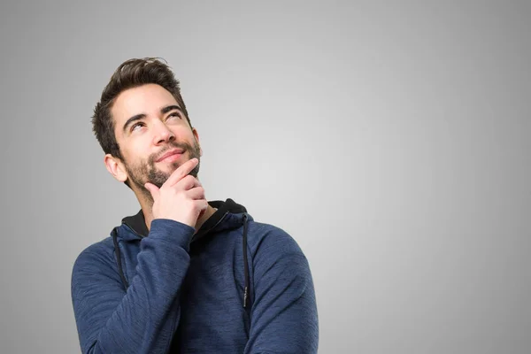 Young Man Thinking Grey Background Stock Photo by ©AsierRomeroCarballo ...