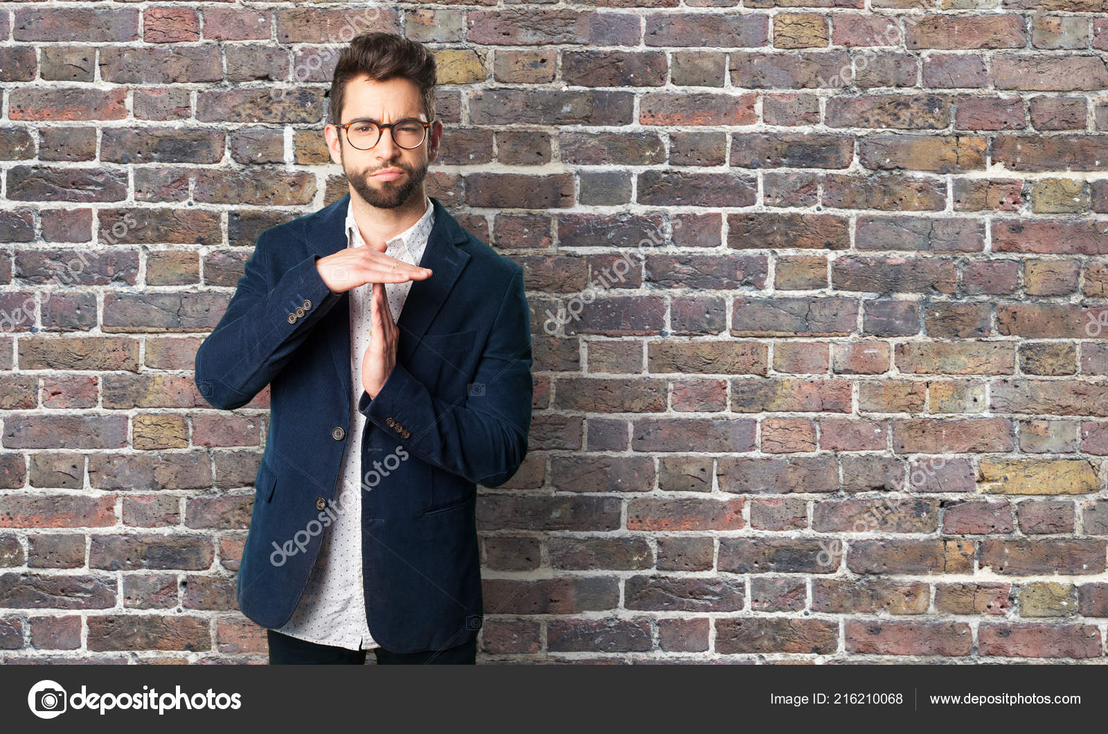 Man Breaking Through Brick Wall