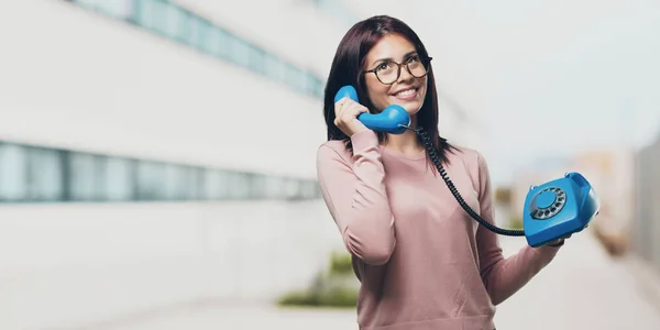 Young pretty woman laughing out loud, having fun with the conversation ...