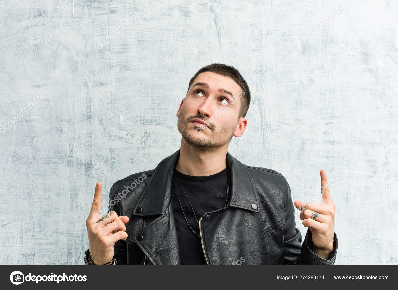 Young Rocker Man Indicates Both Fore Fingers Showing Blank Space ...