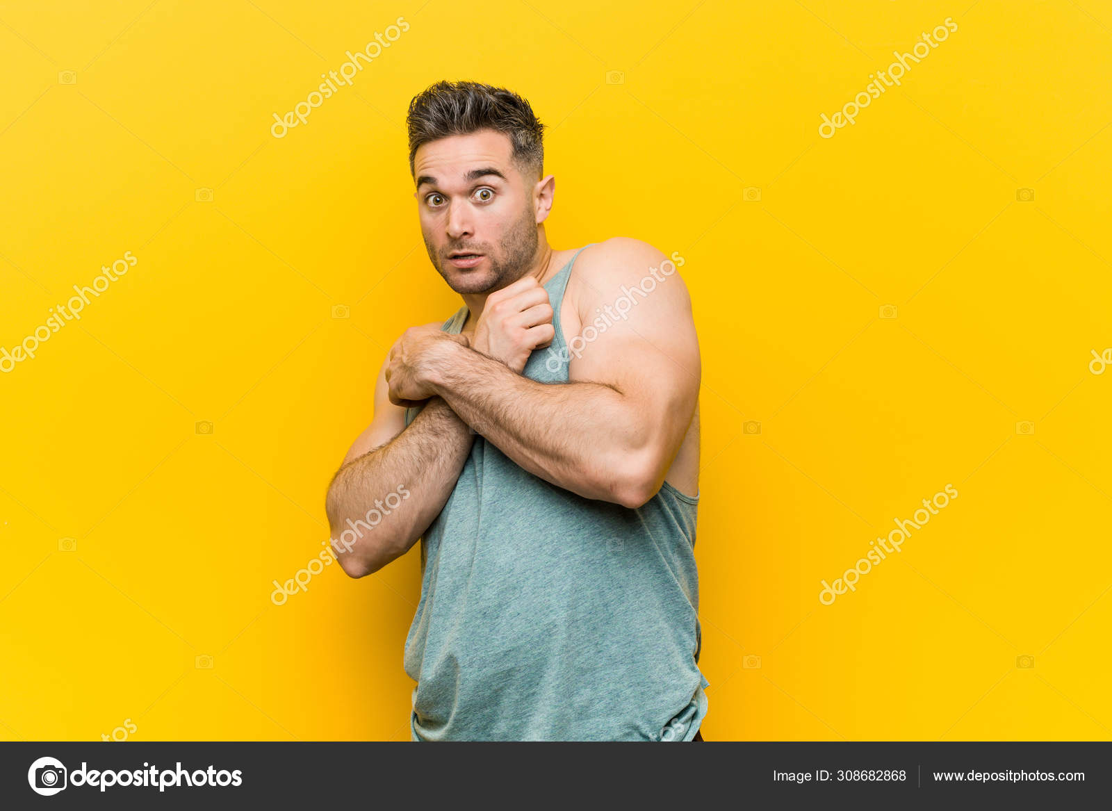Young Fitness Man Yellow Background Scared Afraid Stock Photo by ...