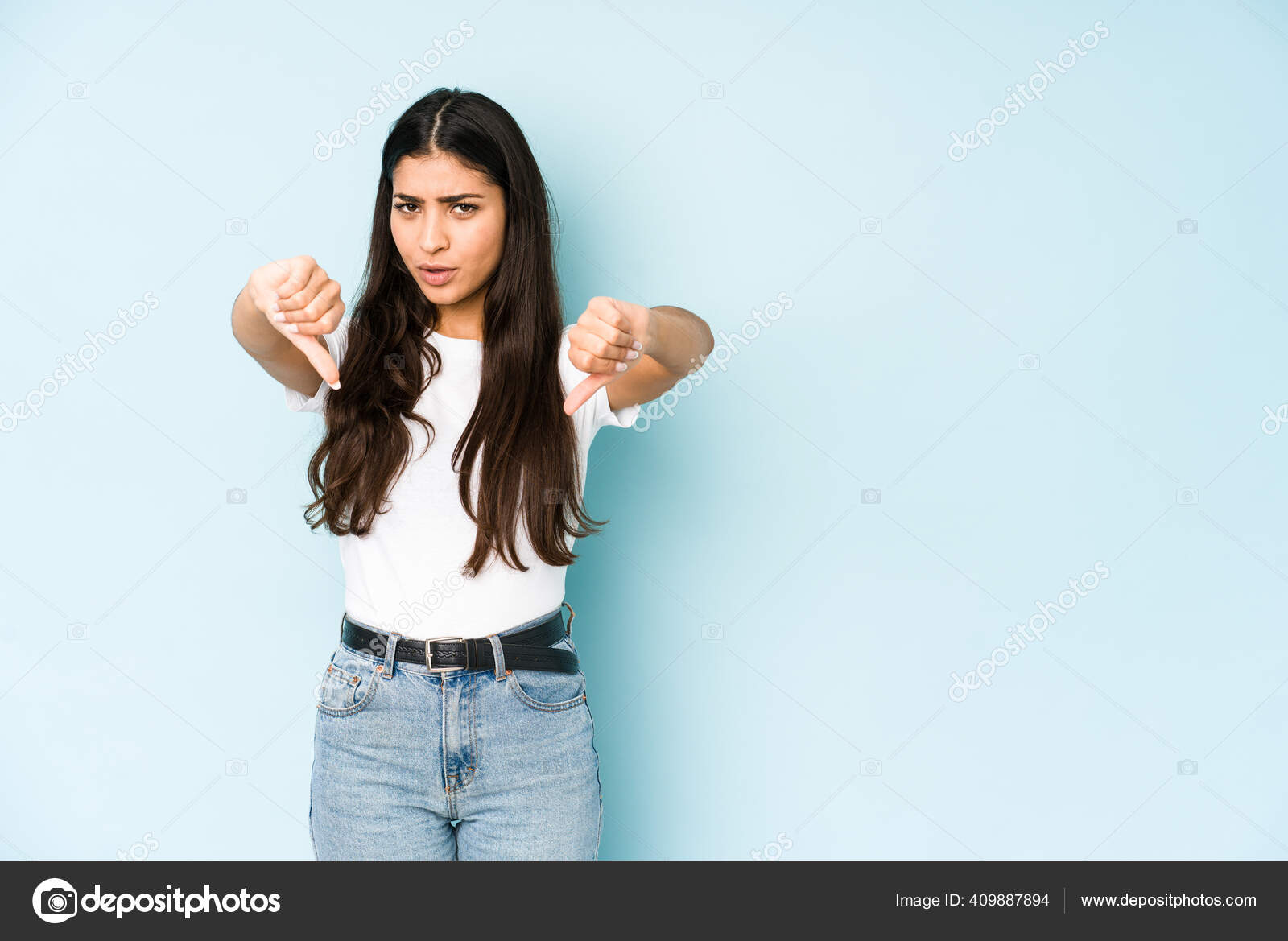 Young Indian Woman Blue Background Showing Thumb Expressing Dislike ...