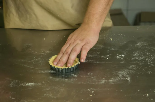 The production process for sweet pastries with fruits. The chef makes ...
