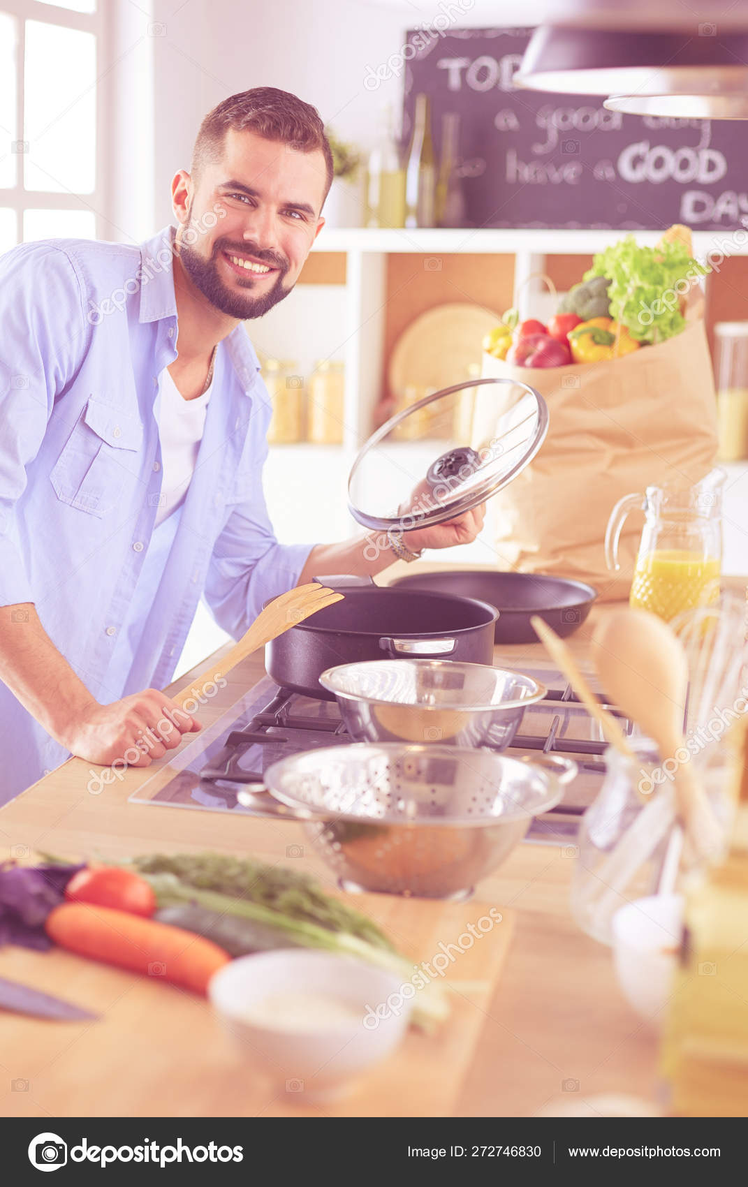 Man following recipe on digital tablet and cooking tasty and healthy ...