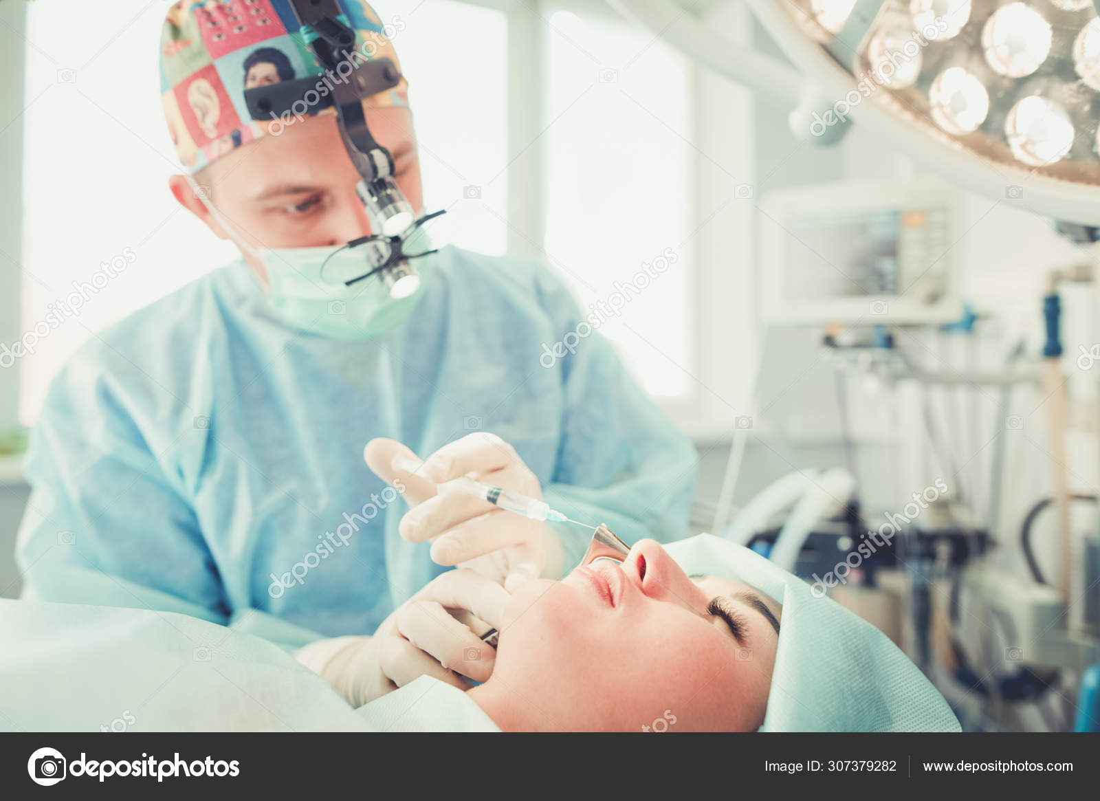 Man surgeon at work in operating room Stock Photo by ©lenetssergey ...