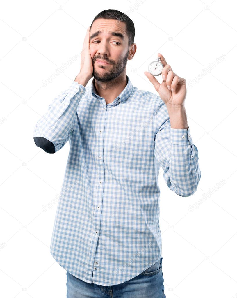 Young Man Holding Stopwatch — Stock Photo © agongallud #222578856