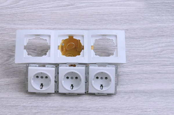 Accessories for the installation of sockets. Triple socket on the floor ...