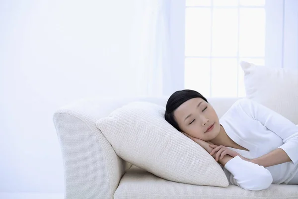 Woman sleeping sofa Stock Photos, Royalty Free Woman sleeping sofa ...