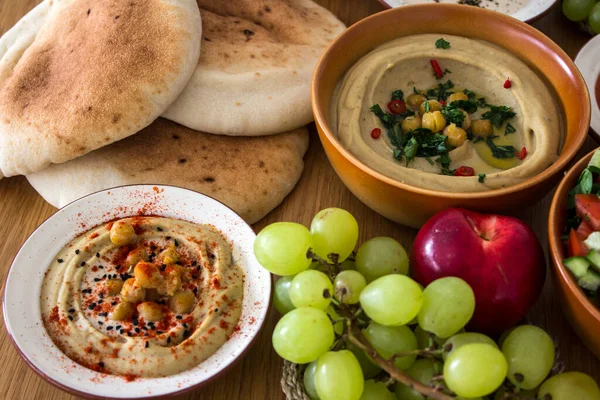 Authentic food of Middle East. Plate of hummus, falafels, pita bread ...