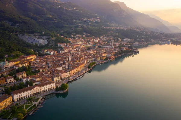 Aerial view of Lake Iseo at sunrise, on the left the city of lovere ...