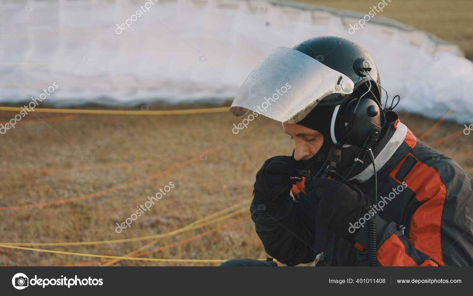 Paramotorgliding. Portrait of a man removing safety helmet after ...