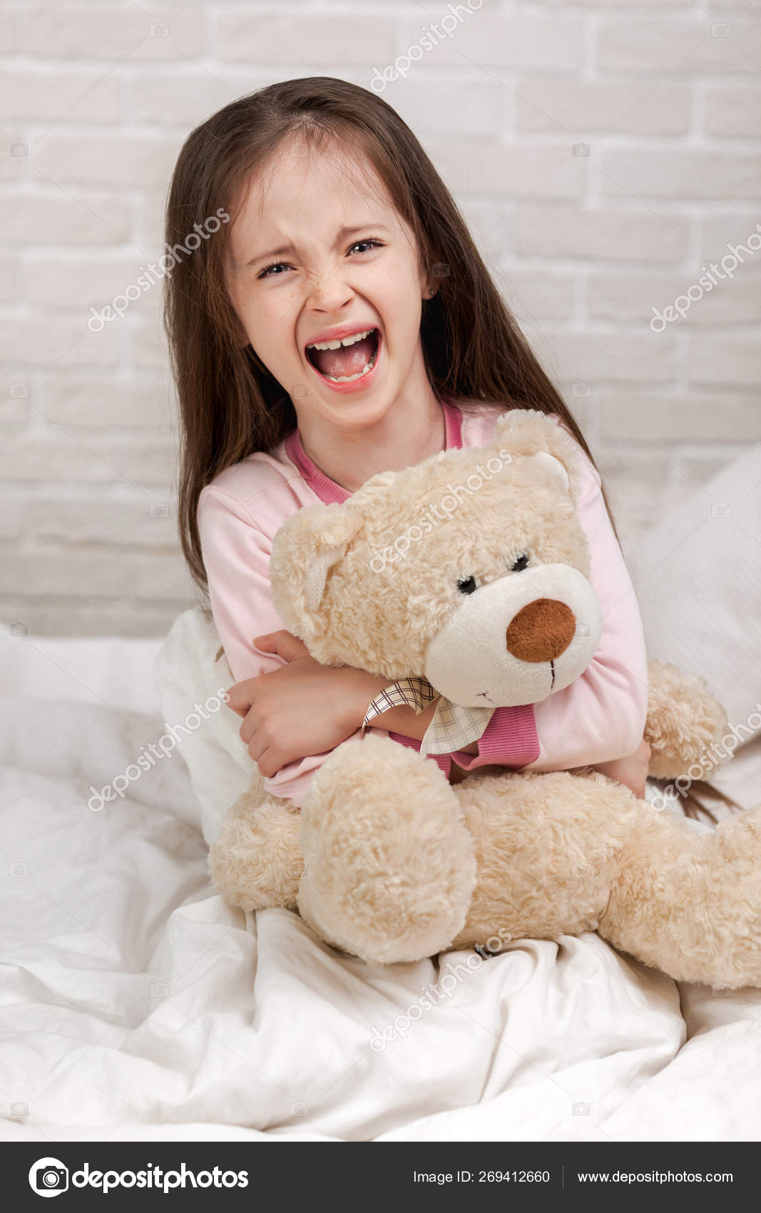 Cute Baby Girl Hugging Teddy Bear