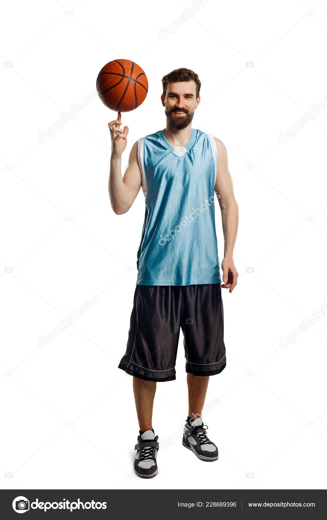 Basketball player spinning a ball — Stock Photo © YGphoto #228689396