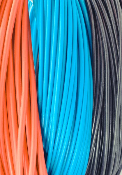 Red, blue and black cables as background, electrical components for ...