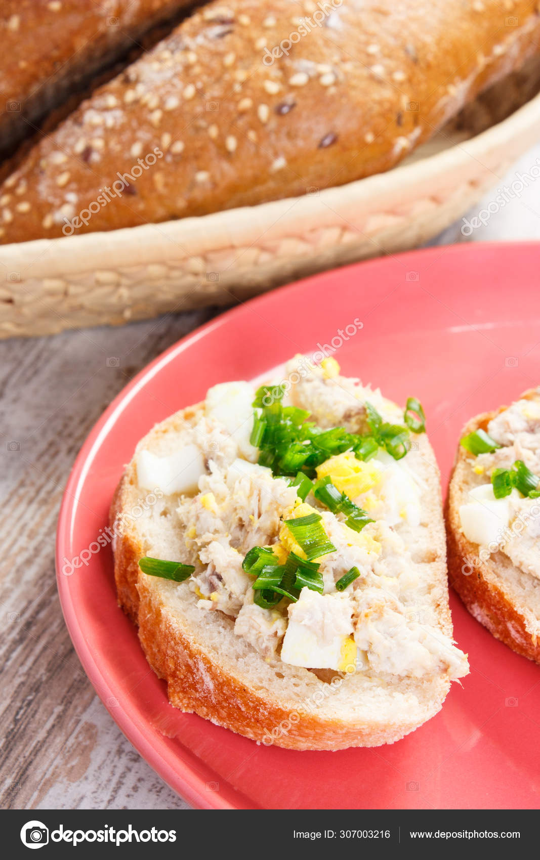 Mackerel or tuna fish paste sandwiches and fresh rolls in background ...
