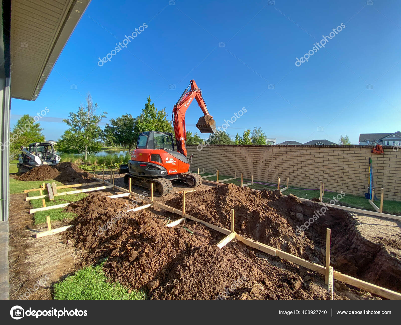 Backhoe Digging A Hole