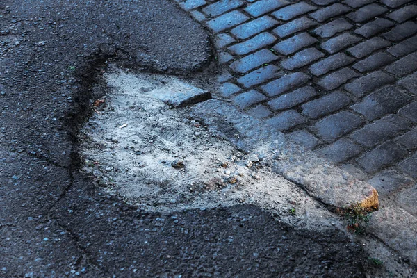 Broken pavements sidewalks on the sidewalk. pavement with paving slabs ...