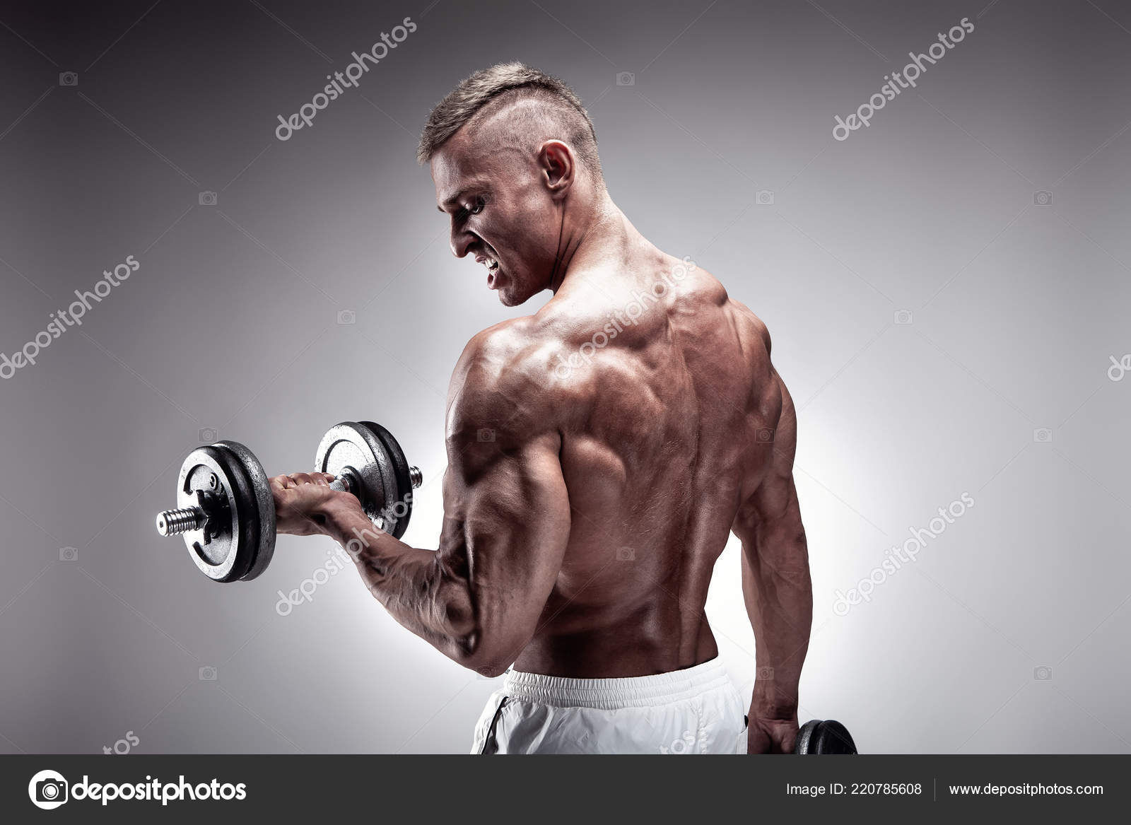Muscular Bodybuilder Guy Doing Exercises Dumbbell Gray Background ...