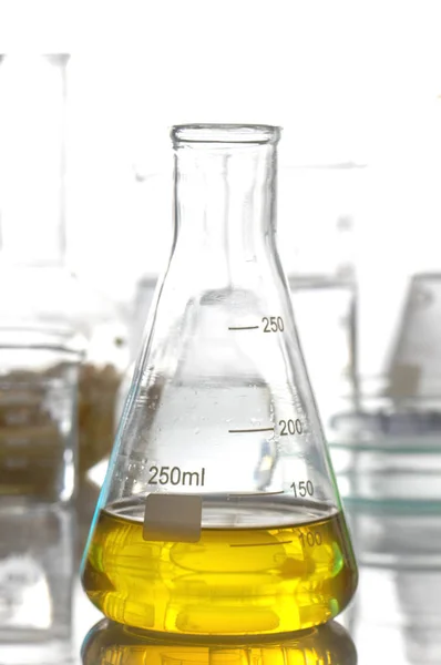 Flask with yellow liquid Stock Photos, Royalty Free Flask with yellow ...