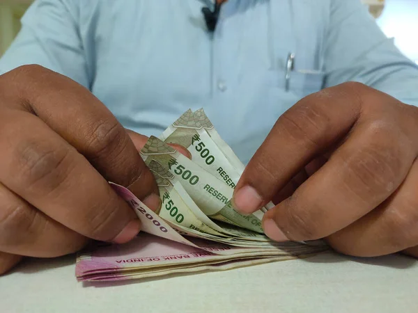 Hand holding indian currency Stock Photos, Royalty Free Hand holding ...