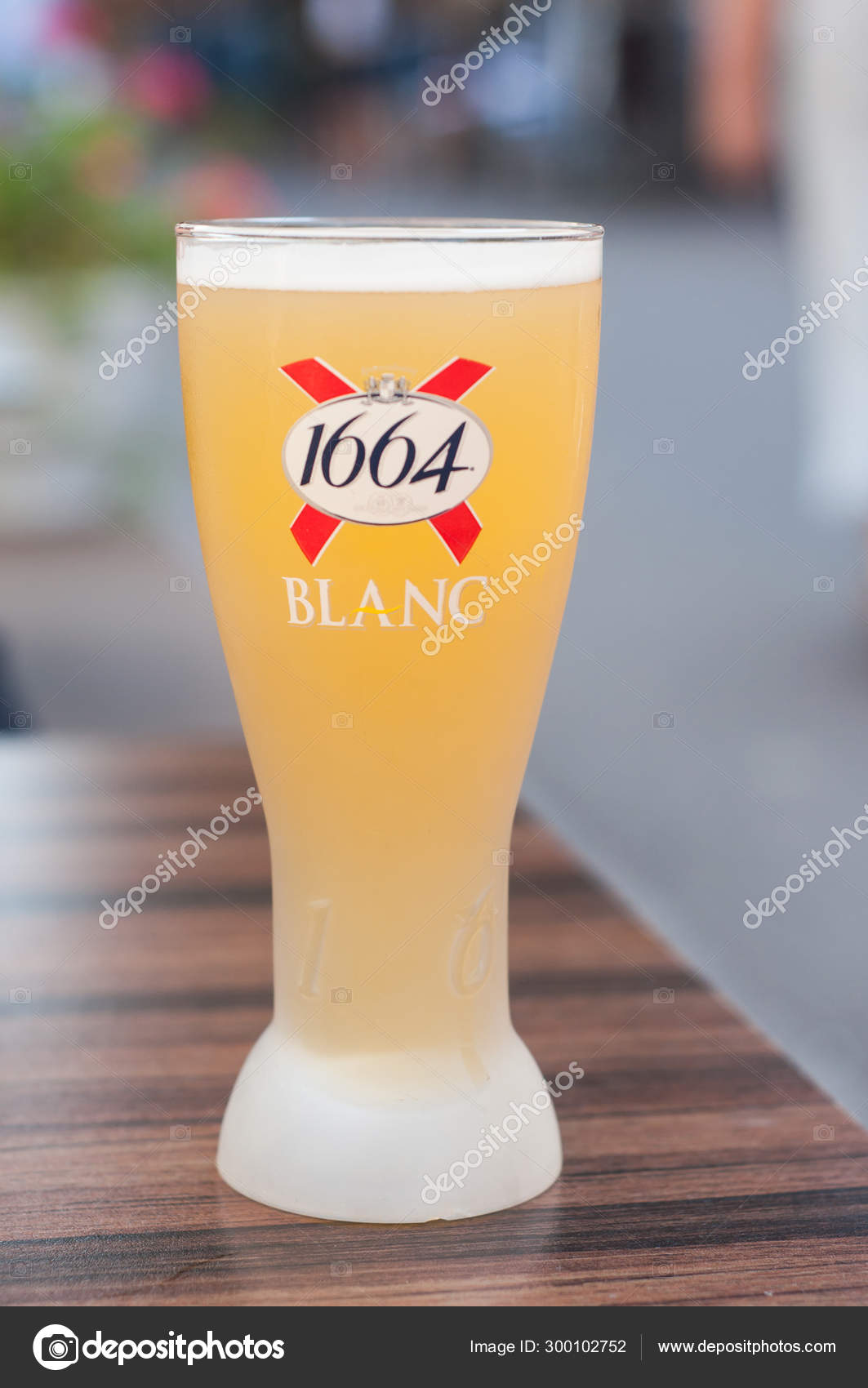 1664 beer glass on the table of restaurant terrace – Stock Editorial ...