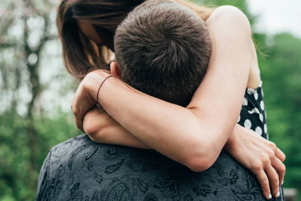 A girl hugs a boy photo to her chest and cries Stock Photos, Royalty ...