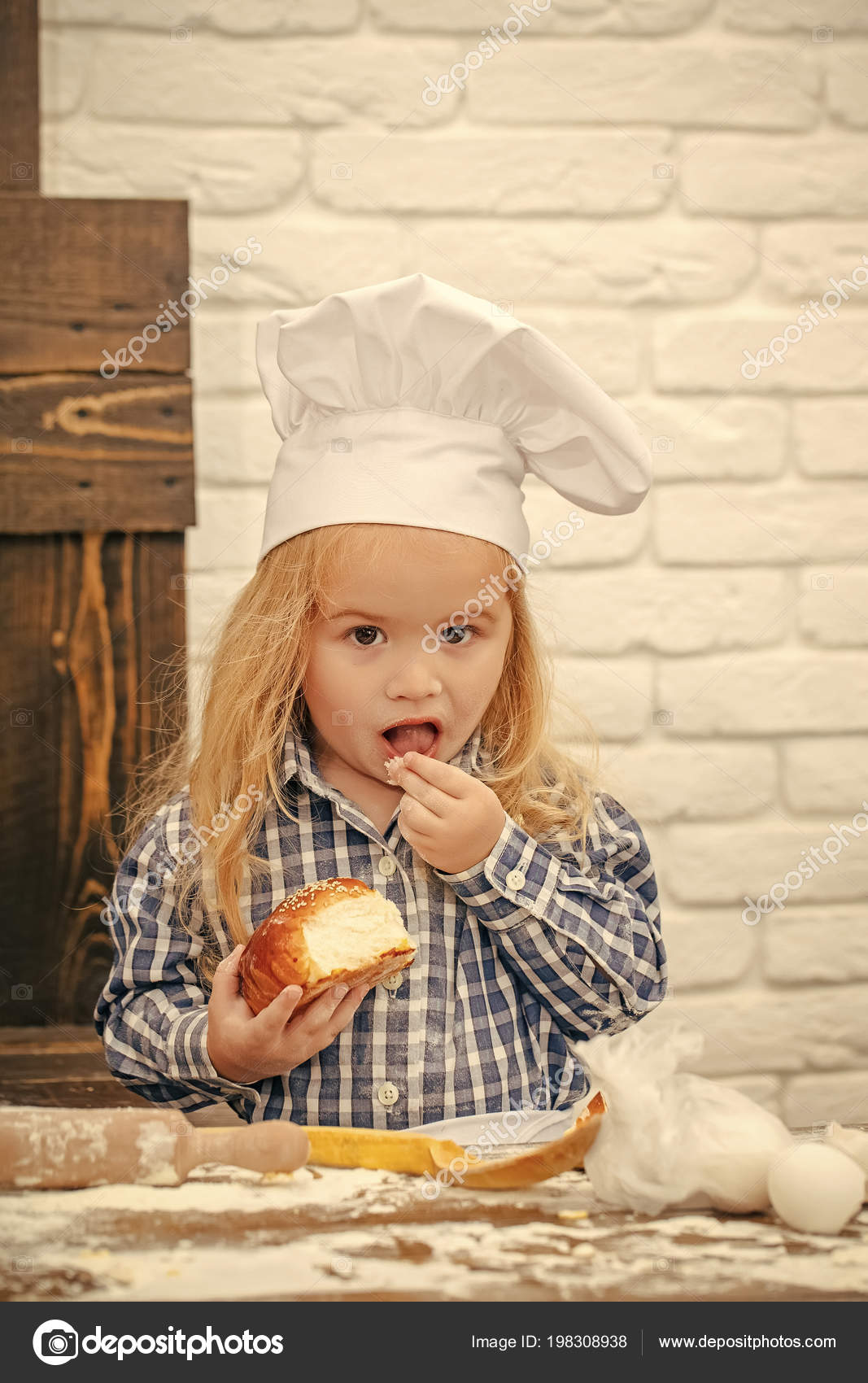 Kids playing - happy game. Boy cook in chef hat in kitchen Stock Photo ...