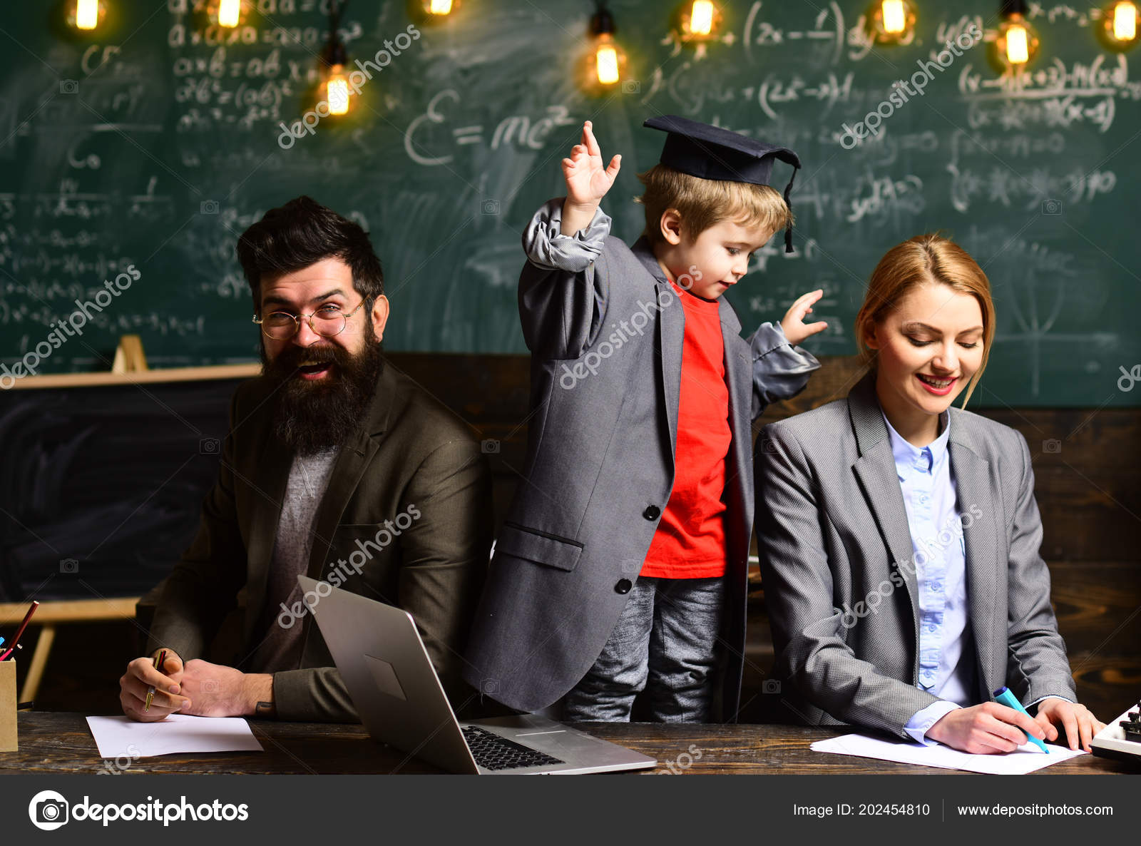 Happy child is learning. E-Learning concept with student holding his ...