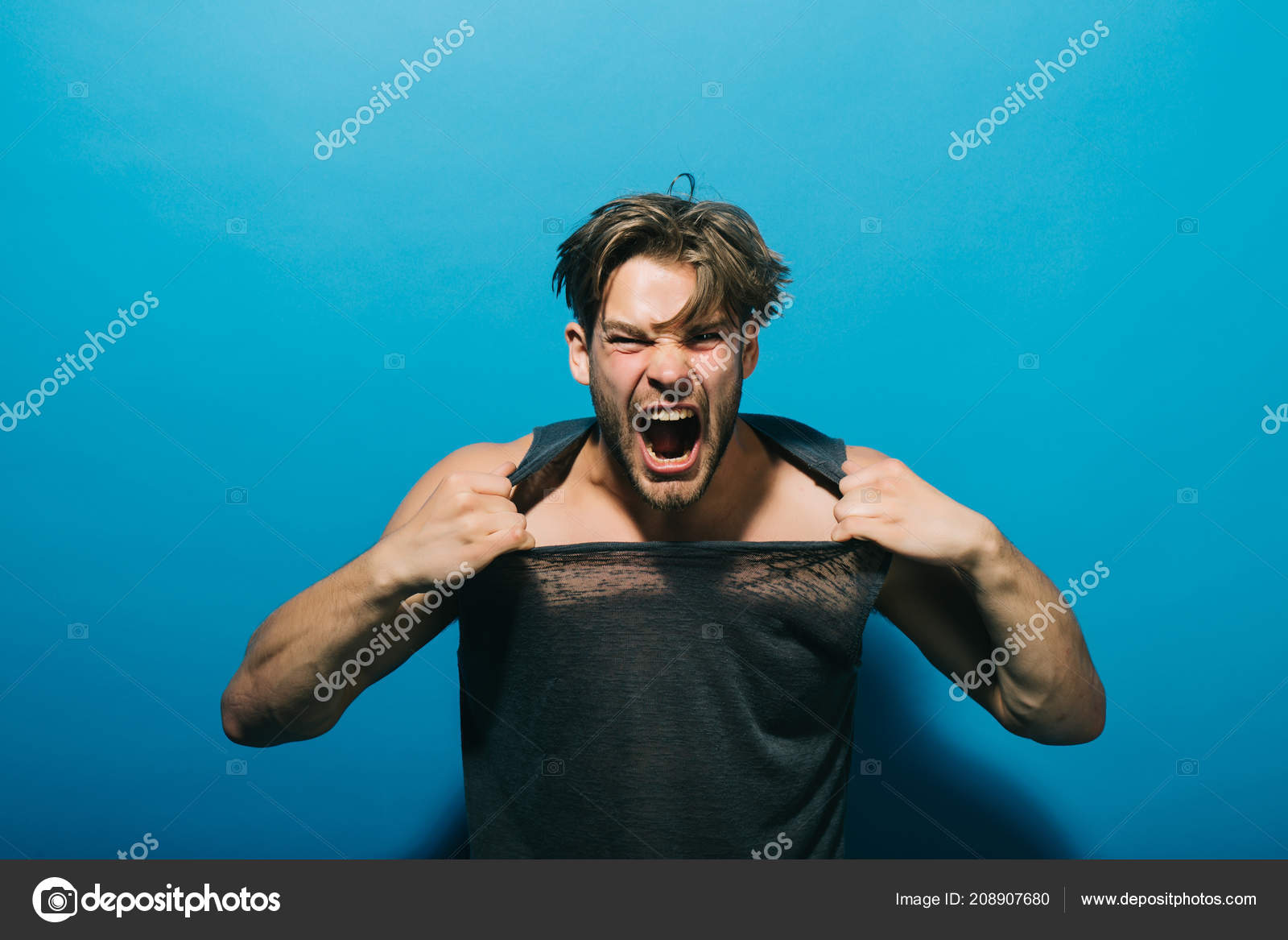 Anger concept. Aggressive man shout with anger. Guy tear tshirt with ...