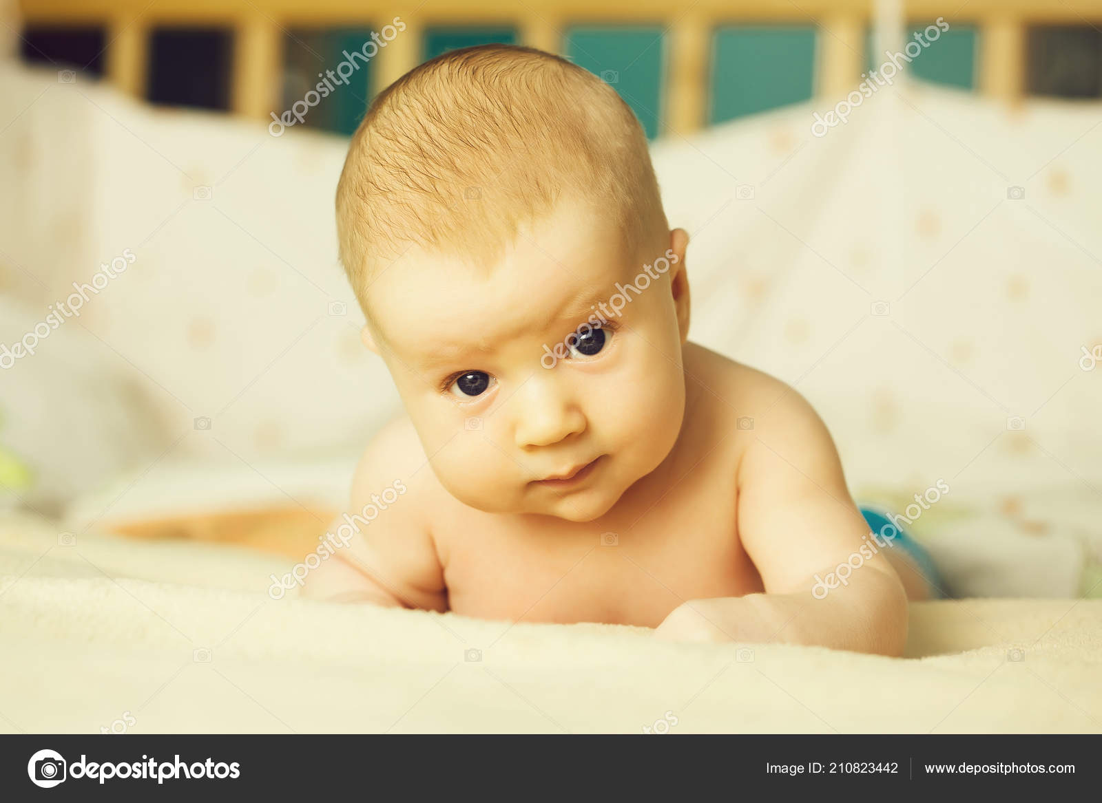 Boy baby laying on tummy Stock Photo by ©Tverdohlib.com 210823442