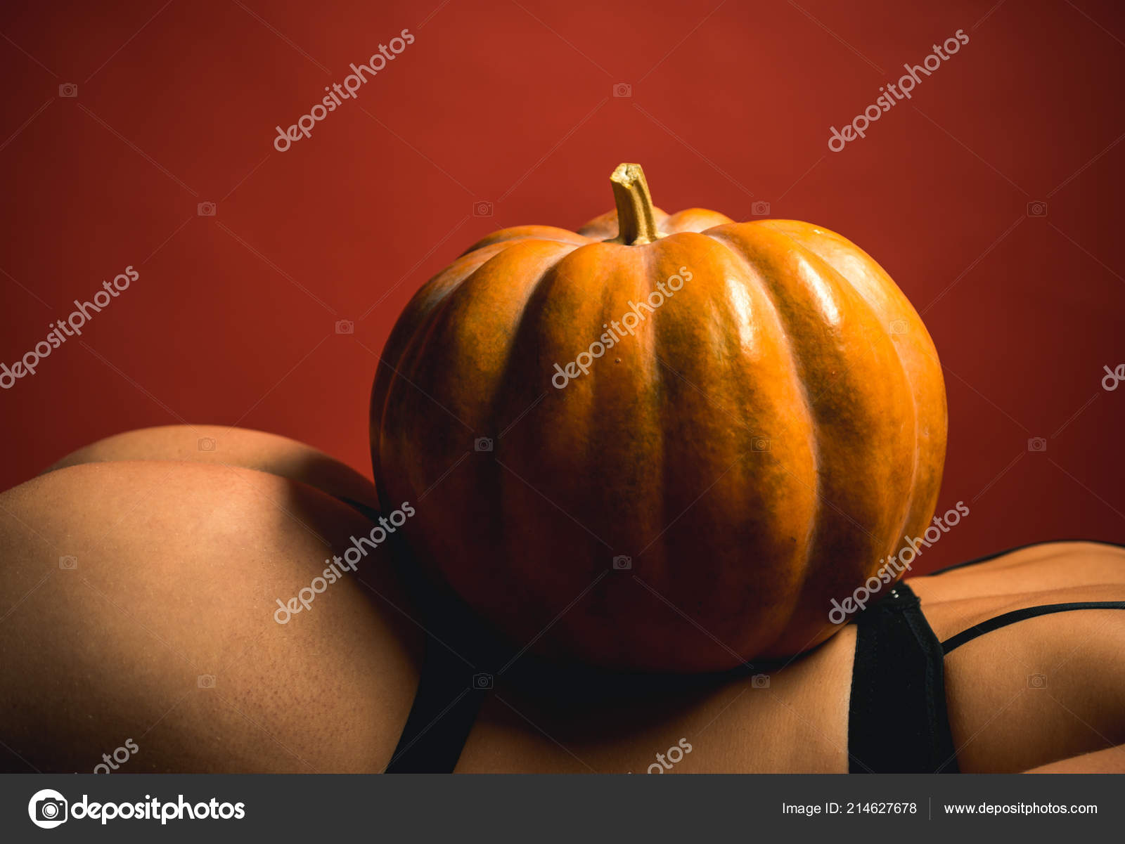 Great ass and pumpkin. Advertisement concept. Sexy pumpkin butt. Halloween Party girls. Sexy ...