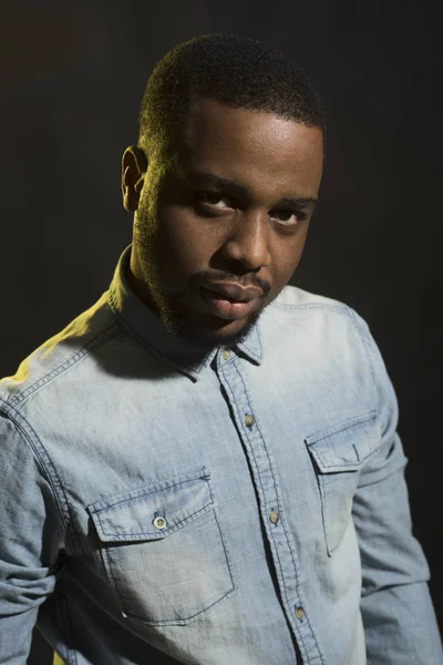 Man On Calm Face Wears Denim Shirt Close Up African Peoples Beauty