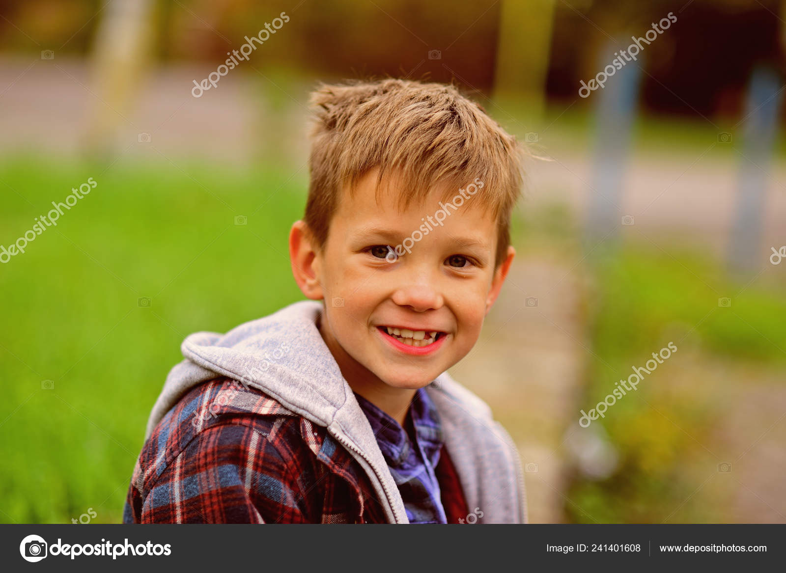 Small and adorable. Happy boy. Small boy smiling outdoor. Upbringing a ...