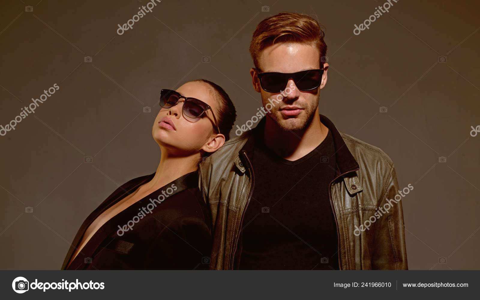 Lucky in having found the perfect partner. Fashion models in trendy sun ...