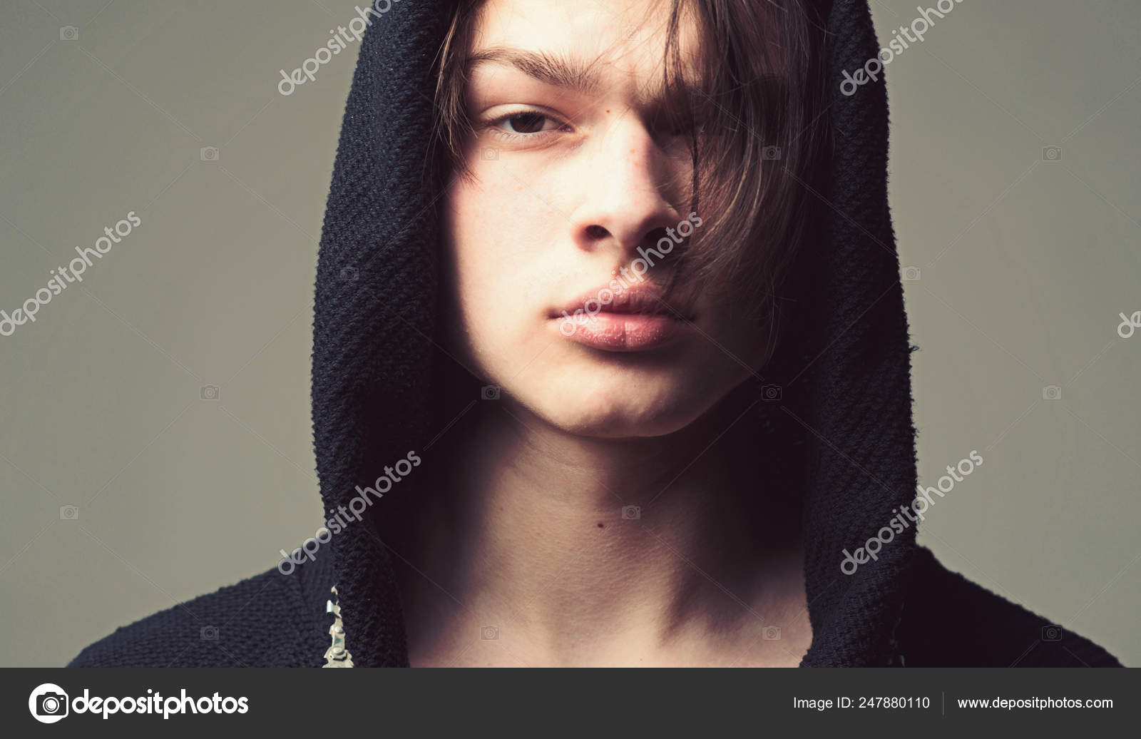 Masculinity concept. Macho in black bathrobe with hood, close up. Guy ...
