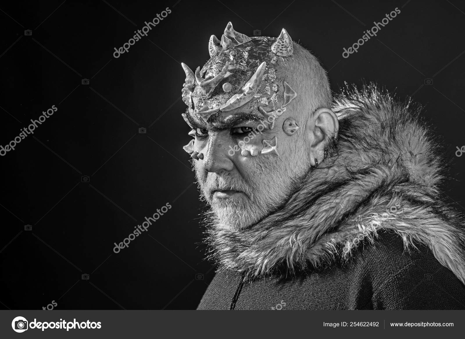 Alien, demon, sorcerer makeup. Demon on black background, copy space ...