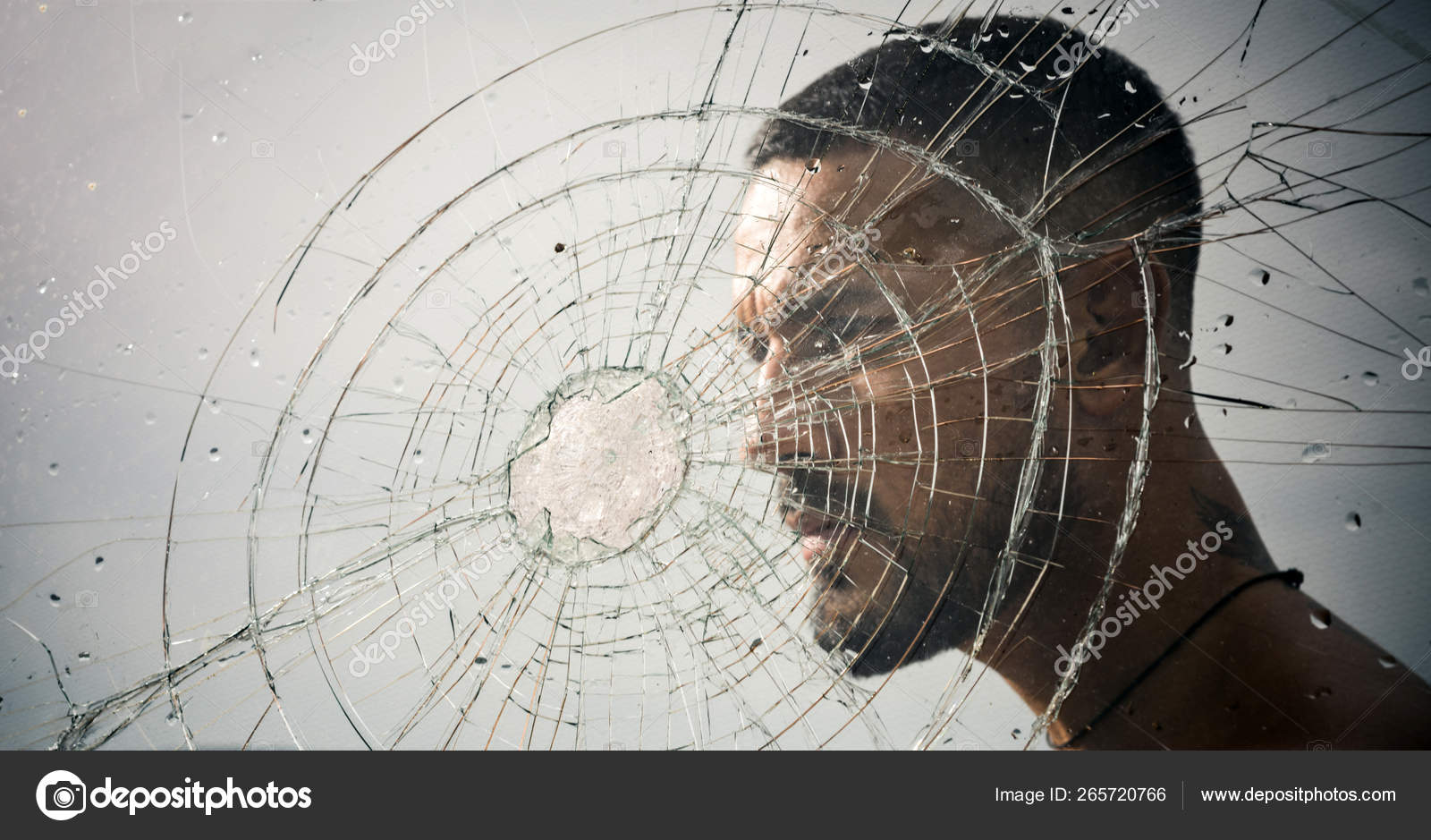 Crack. macho man behind crushed glass. anger. destruction. crush test ...