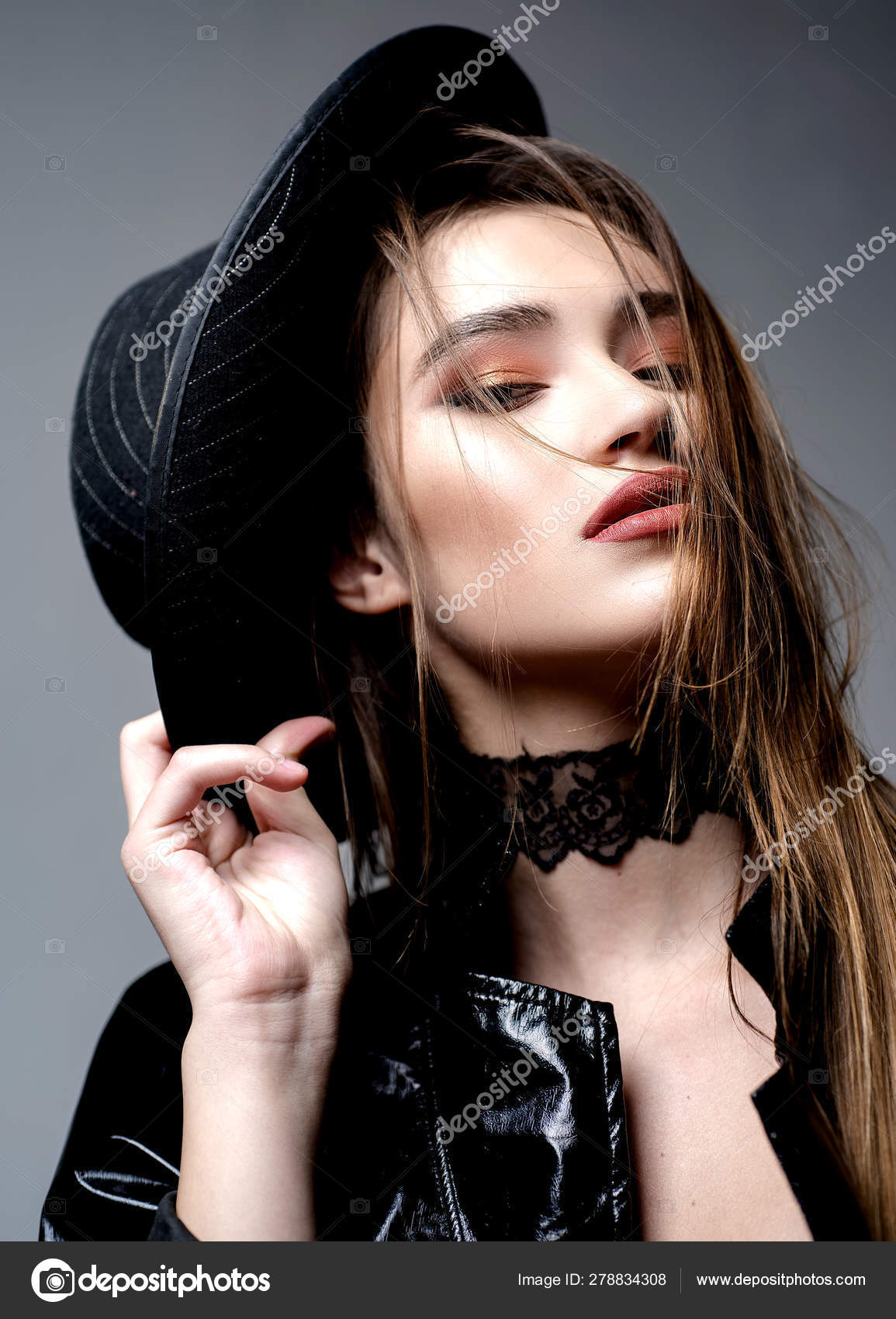 Attractive Woman With Seductive Lips And Gentle Makeup On Black