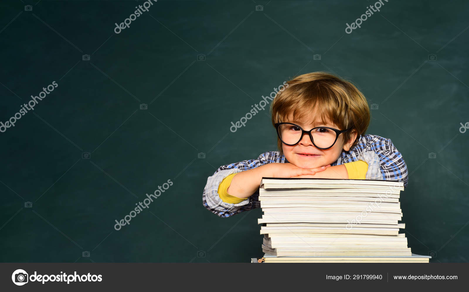 Funny little boy pointing up on blackboard. School concept. School kids ...