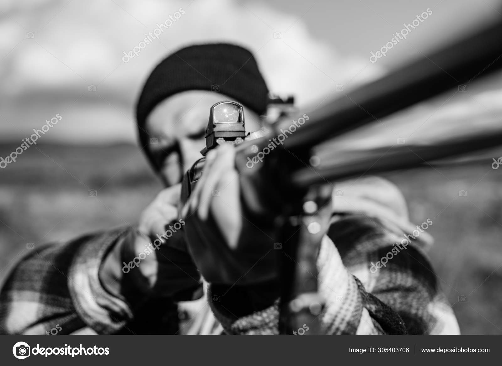 Hunter Target with laser sight. Collimating sight. Hunter with shotgun ...