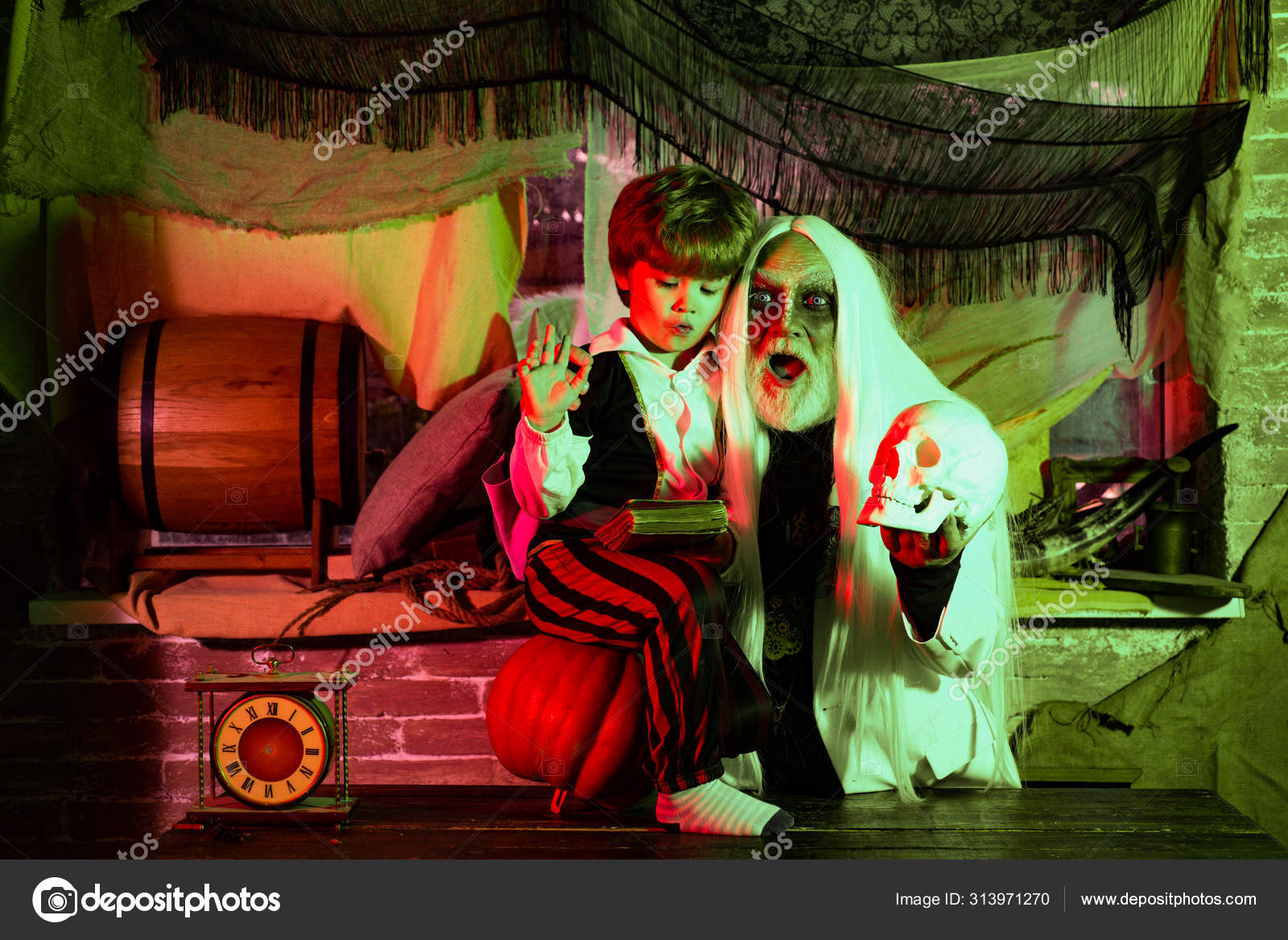 Father and son playing scary Halloween games at home. Son and father ...