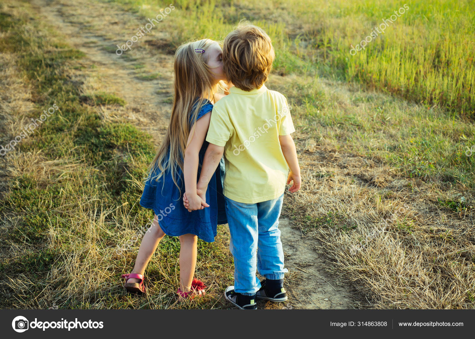 Kid having fun in spring field. Child playing Happy childhood. Cute ...