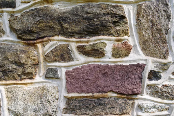 Old Pennsylvania fieldstone wall close up with beautiful red stone ...